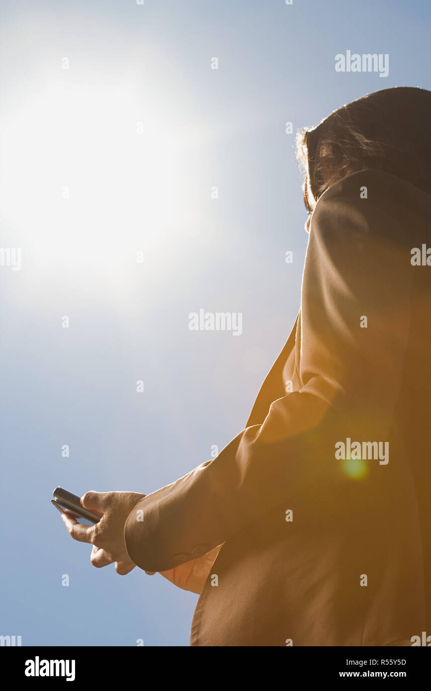 Person using handheld computer Stock Photo - Alamy