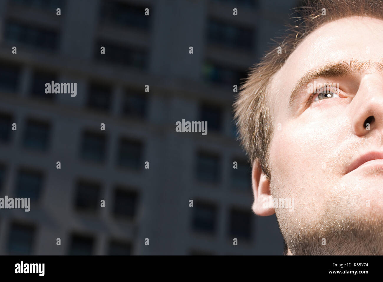 Man looking up Stock Photo - Alamy