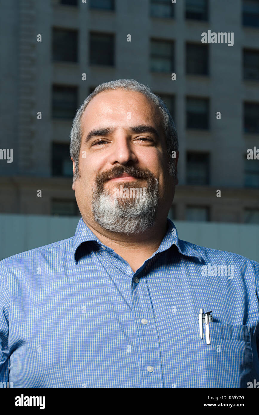 Man in a blue shirt Stock Photo - Alamy