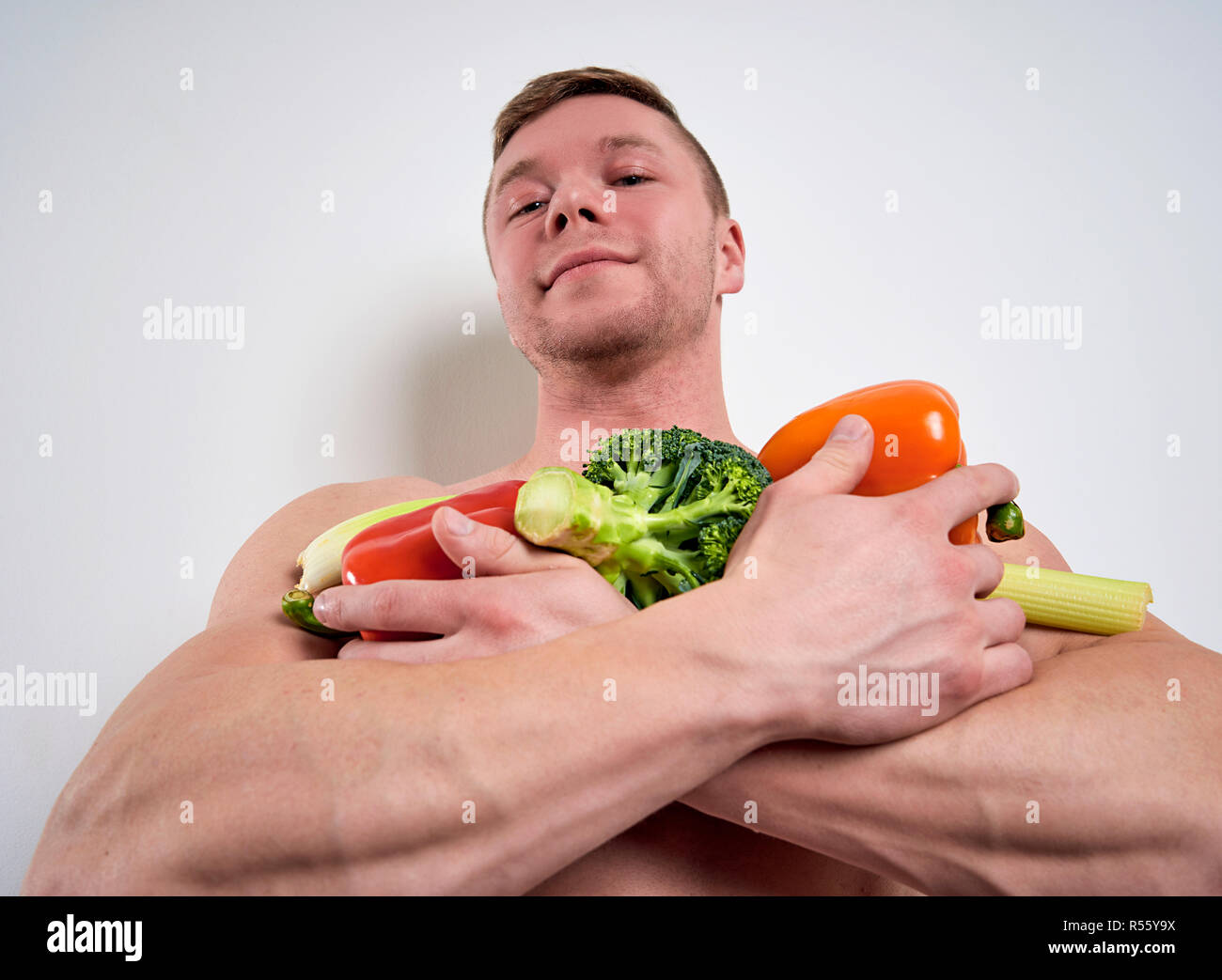 Man eating vegetable muscular hi-res stock photography and images - Alamy
