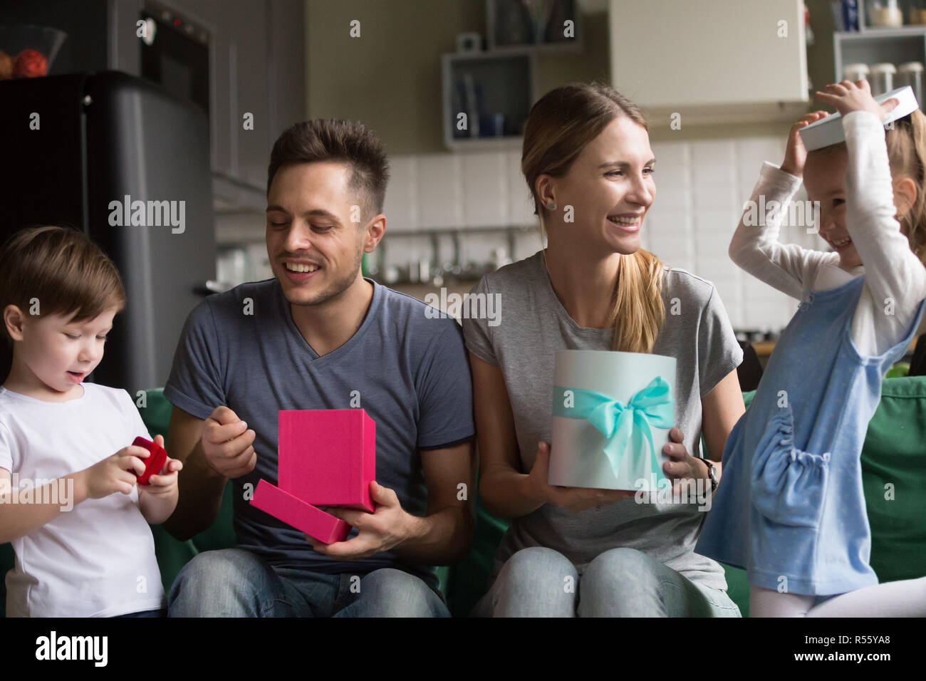 Happy large family unpacking gifts with son and daughter Stock Photo ...