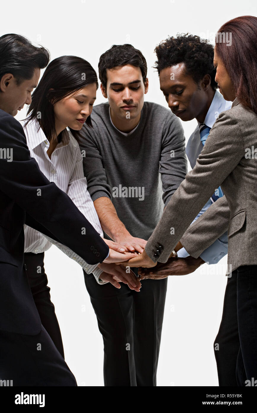 five office workers showing unity Stock Photo - Alamy