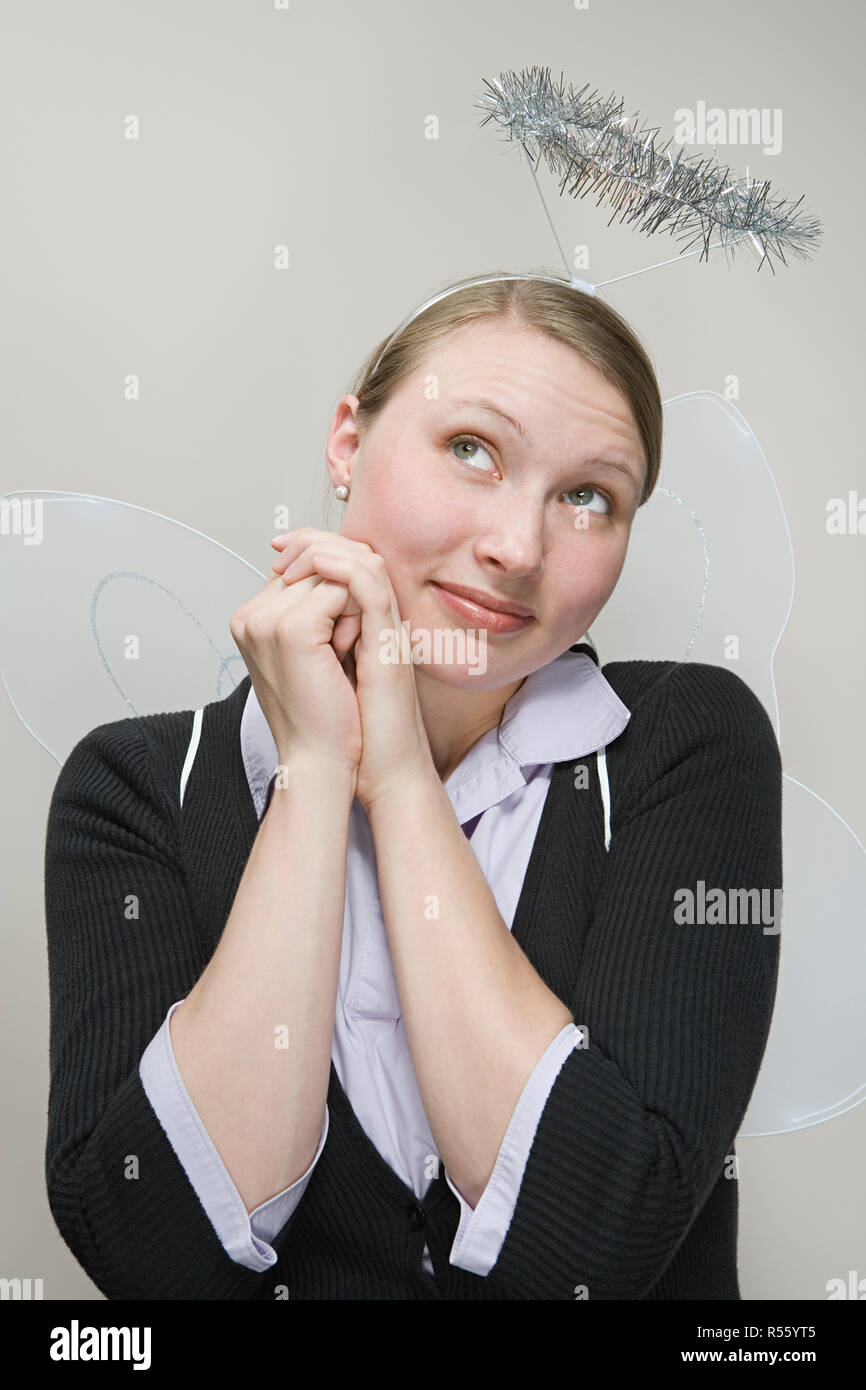 Office worker dressed as an angel Stock Photo - Alamy