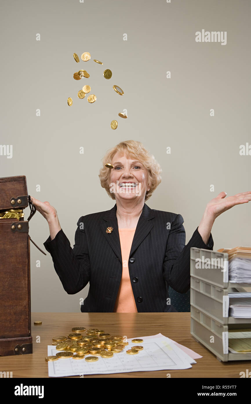 Businesswoman throwing money Stock Photo - Alamy