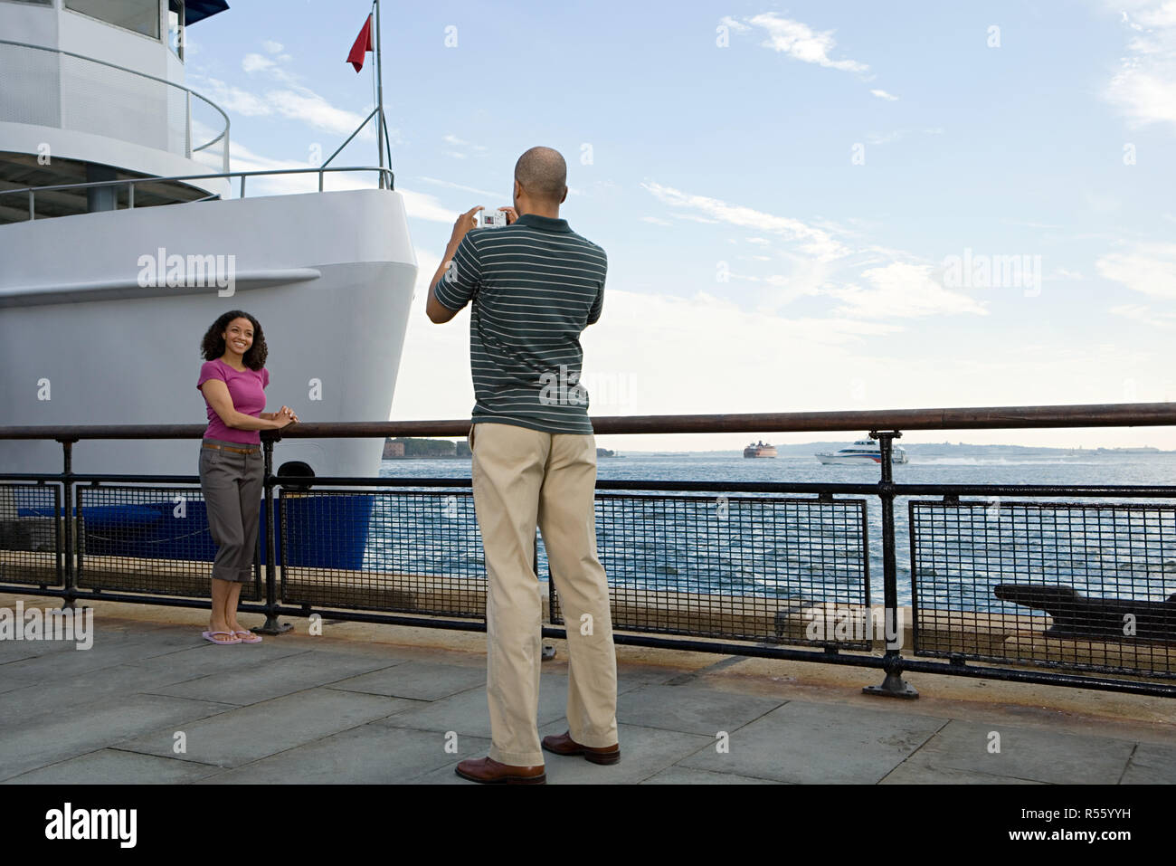 Man photographing woman Stock Photo - Alamy