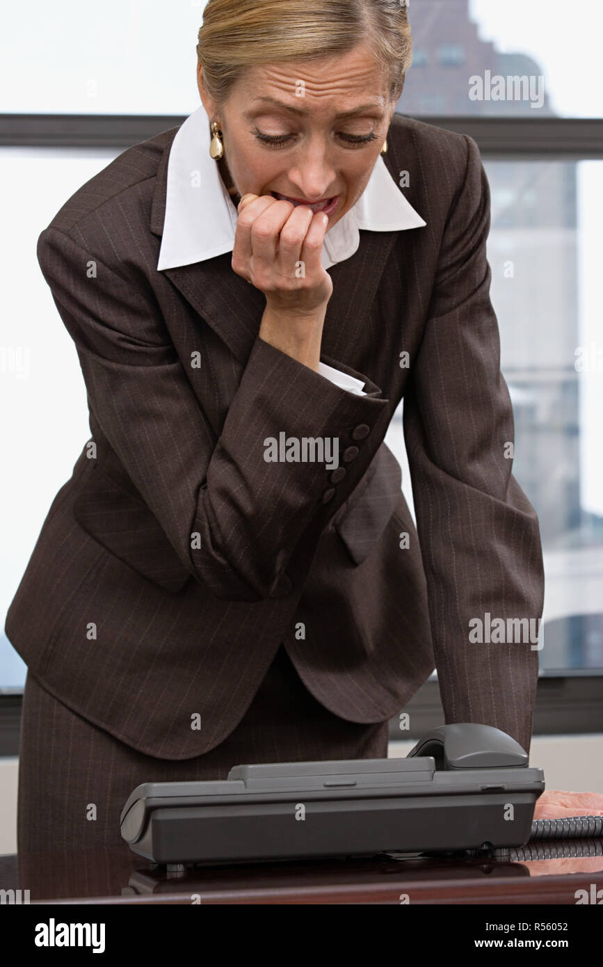 Woman waiting for phone call Stock Photo - Alamy