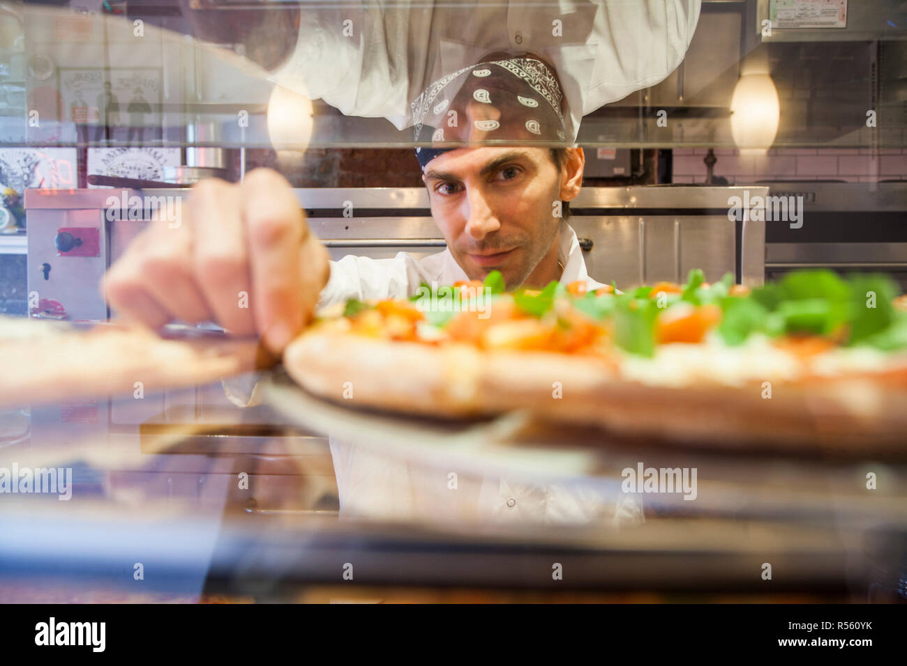 Pizza place chef Stock Photo - Alamy