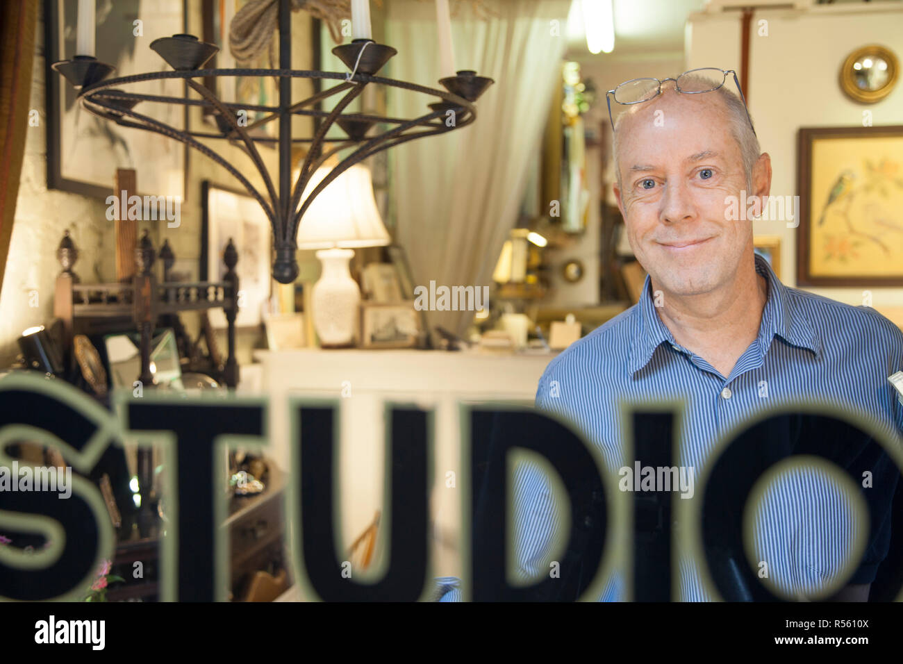 Frame shop owner Stock Photo - Alamy