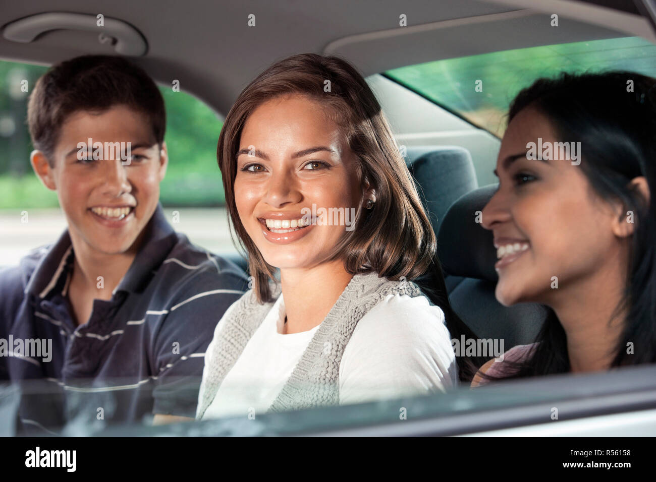 Teenagers riding in car Stock Photo - Alamy