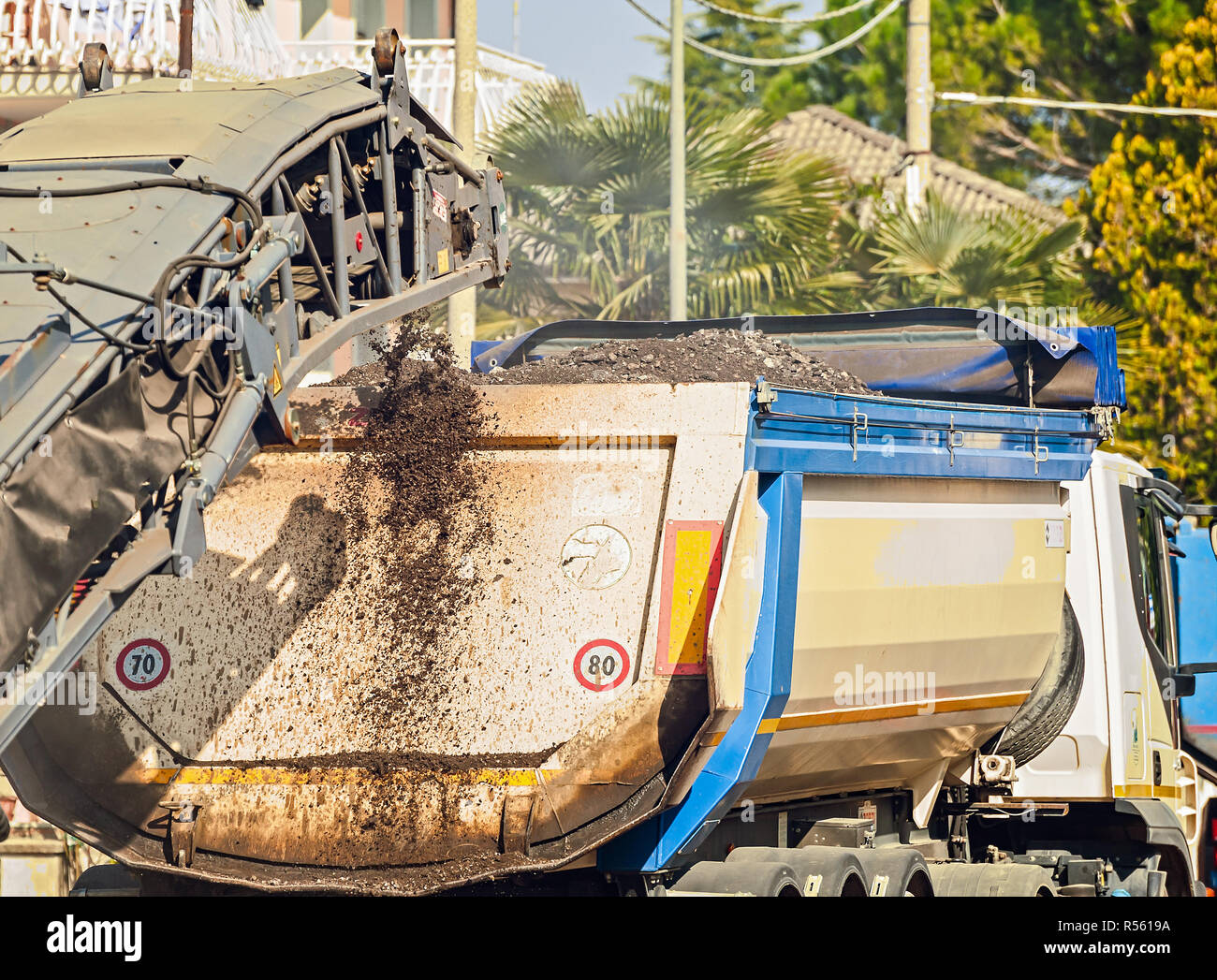 Tipper truck used in work of asphalting. Road construction Stock Photo ...