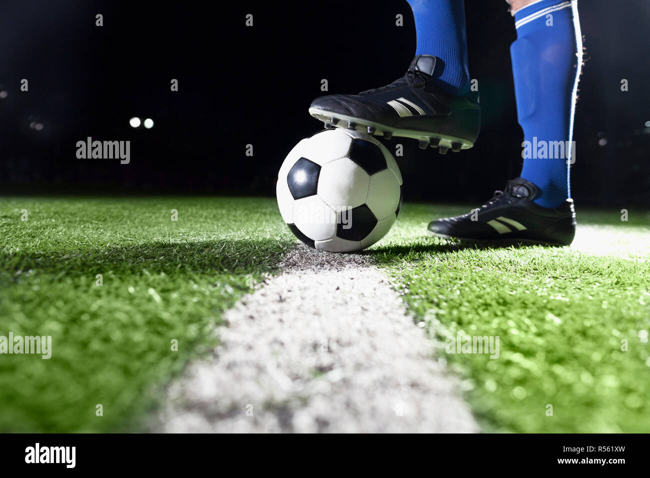 Foot on soccer ball Stock Photo - Alamy