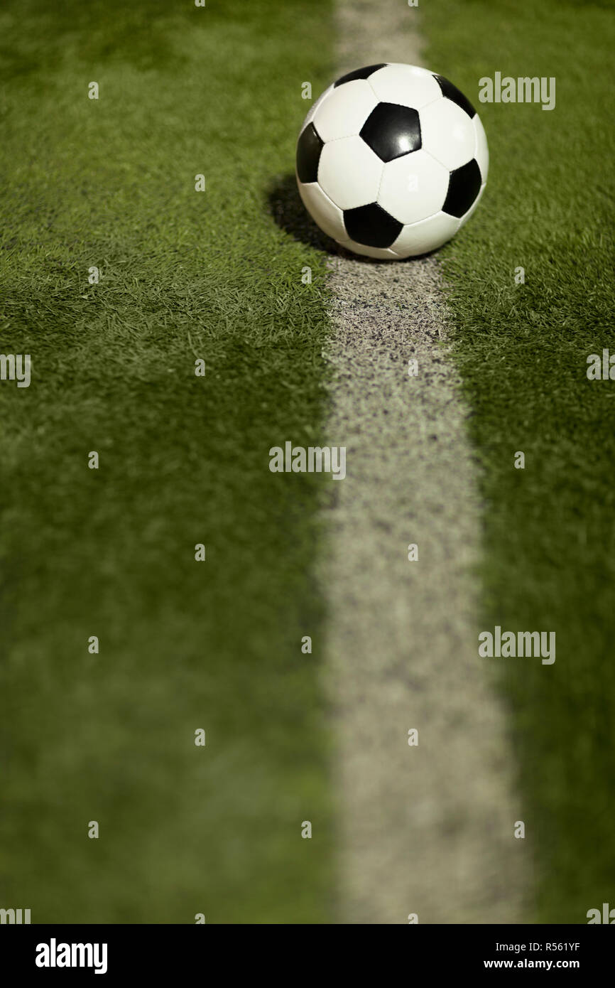 Soccer ball on sports field Stock Photo - Alamy