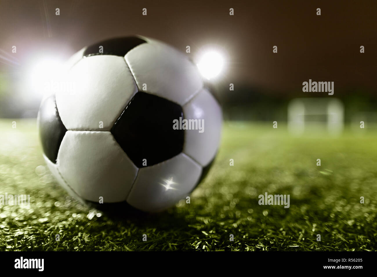 Soccer ball on sports field Stock Photo - Alamy