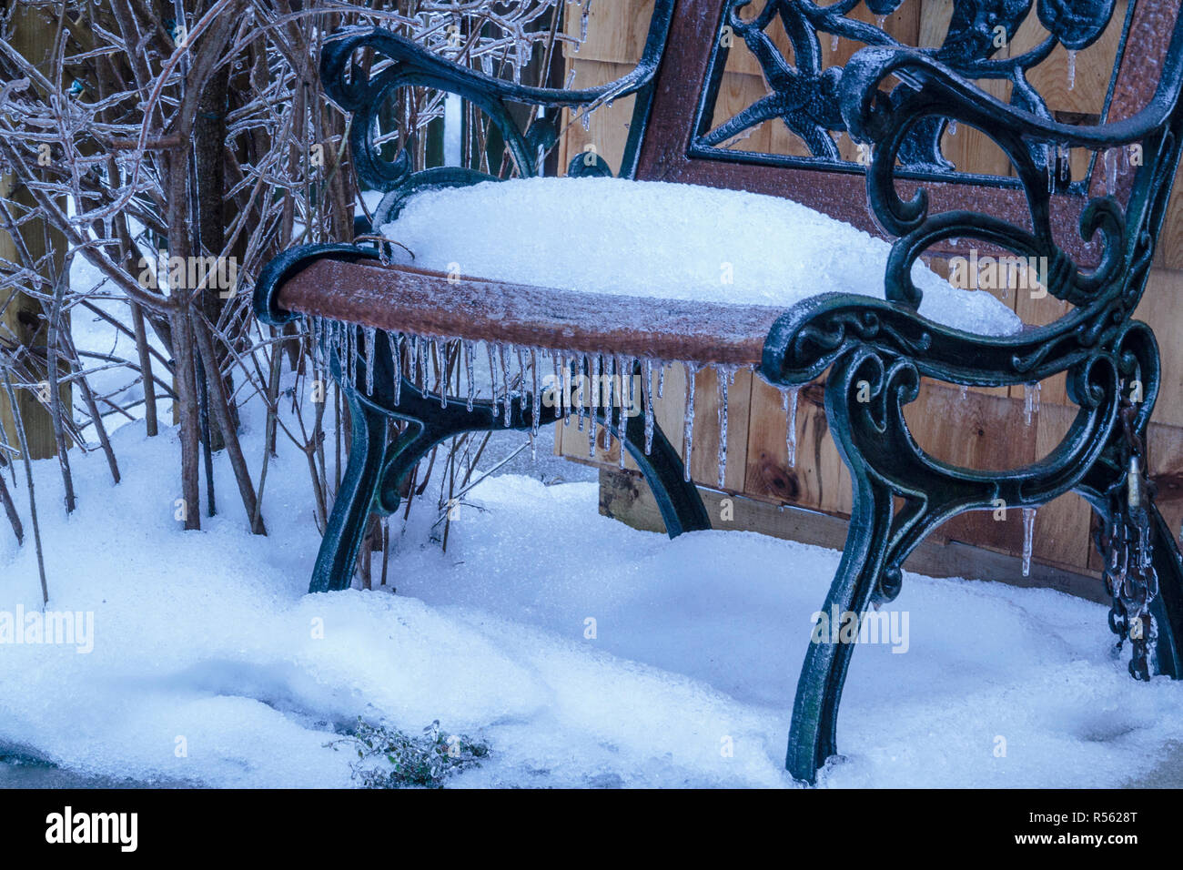 Icycles on an outdoor patio chair after freezing rain Stock Photo - Alamy