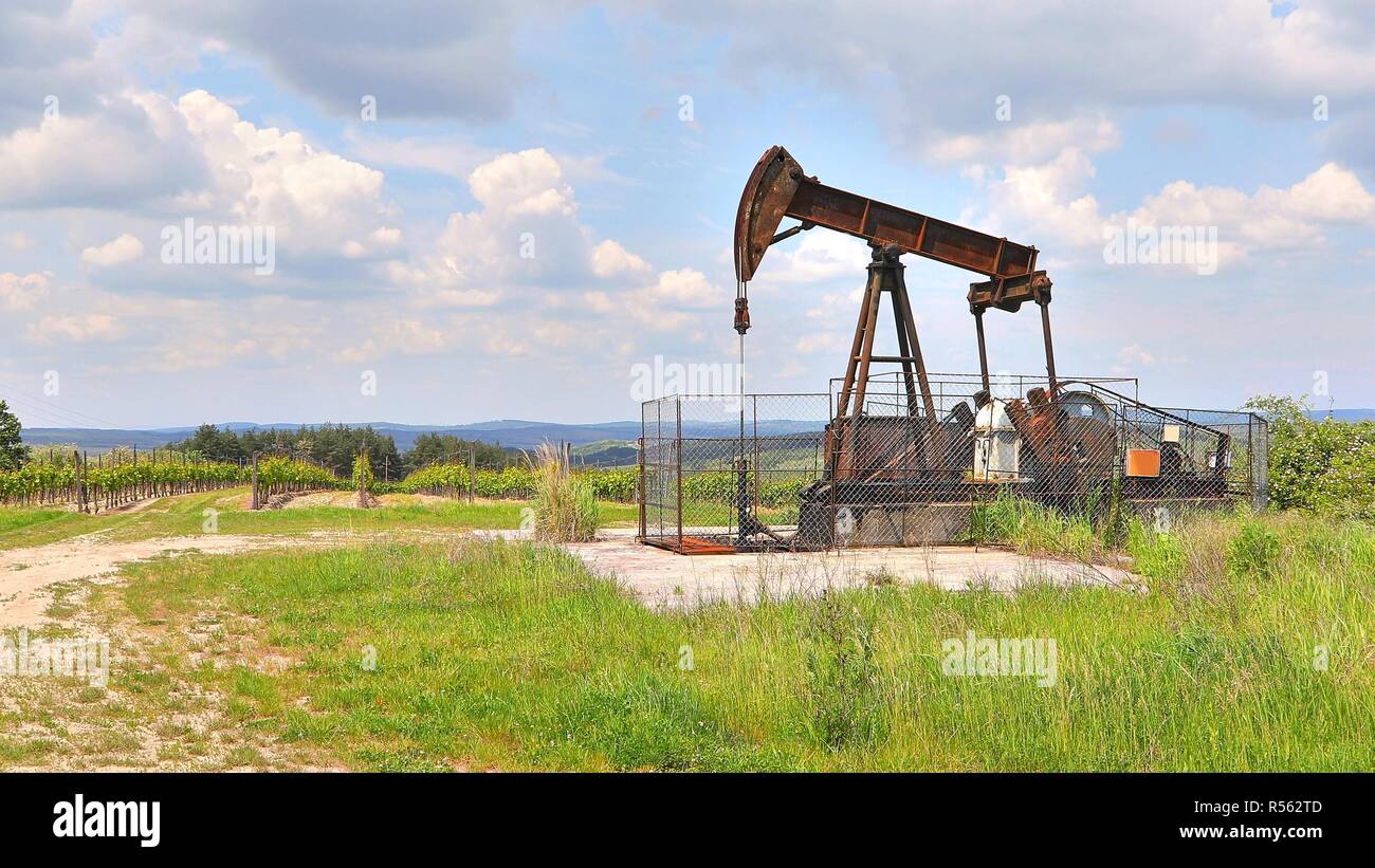 Oil well on a landscape Stock Photo - Alamy