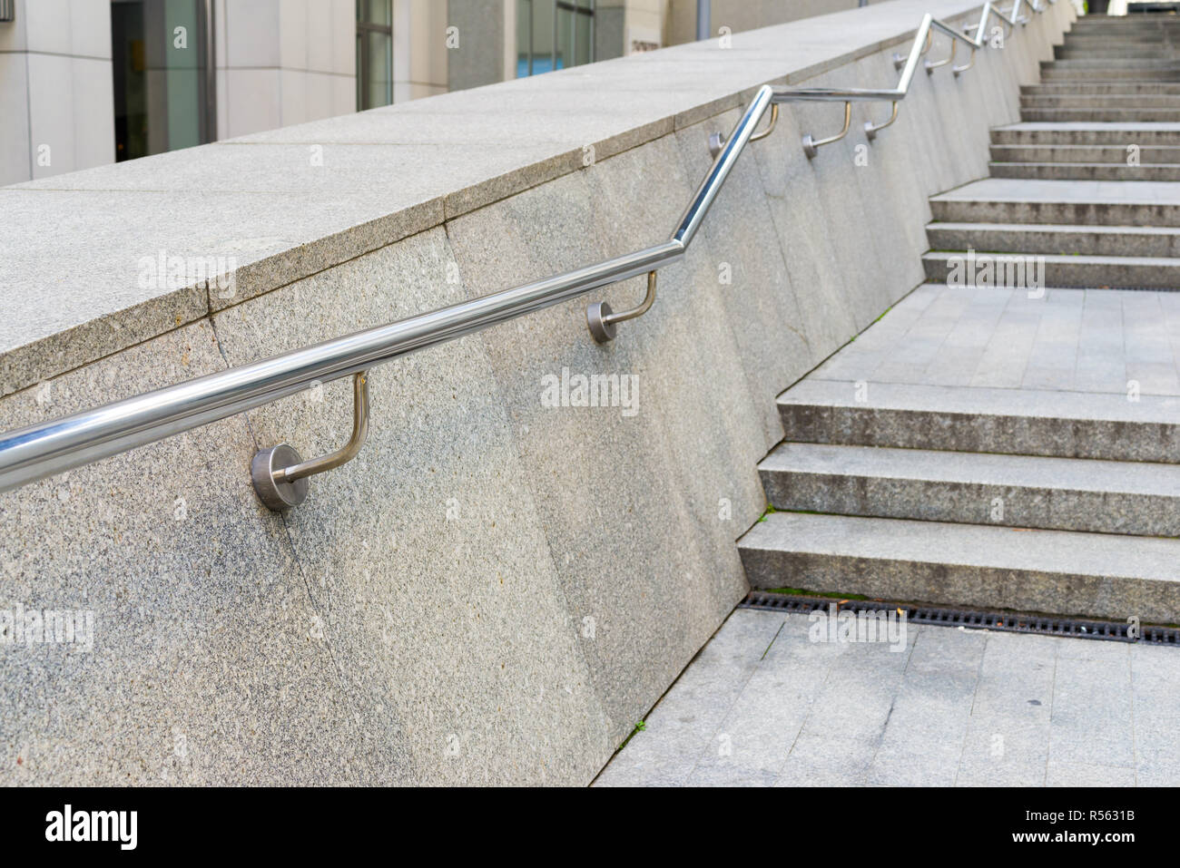 stainless steel metal handrails on stone steps Stock Photo - Alamy