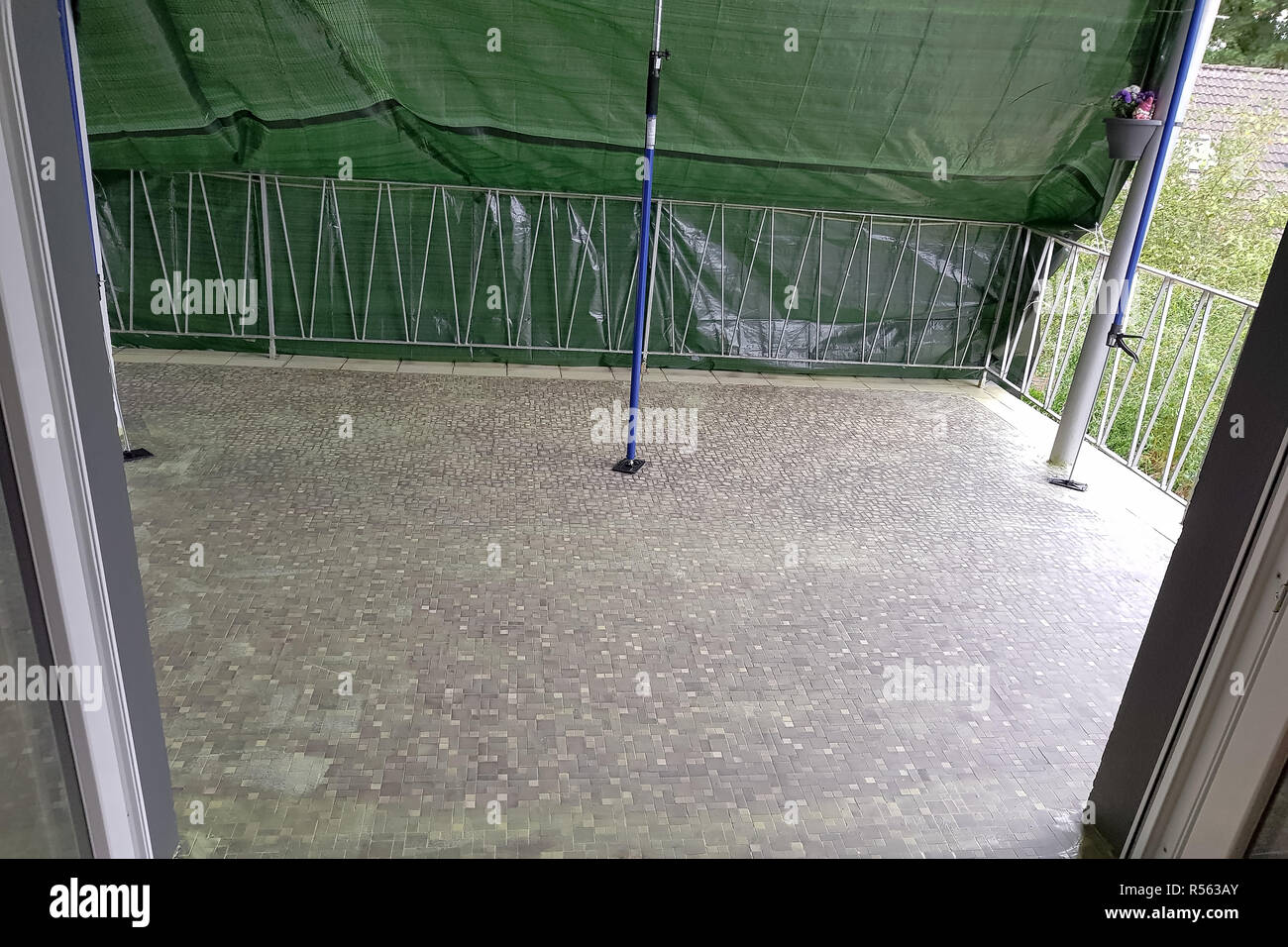 Balcony floor tiles installation. Laying tiles from porcelain. Interior ...