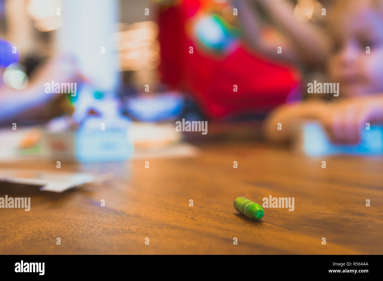 Green color pastel crayon on brown wooden table Stock Photo - Alamy