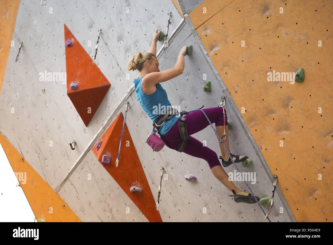 bouldering, girl climbing up the wall Stock Photo - Alamy