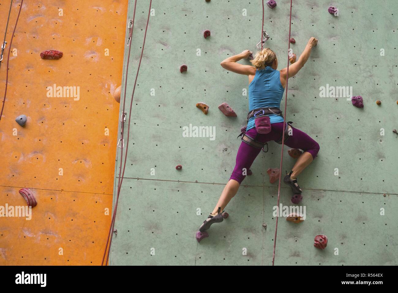 bouldering, girl climbing up the wall Stock Photo - Alamy