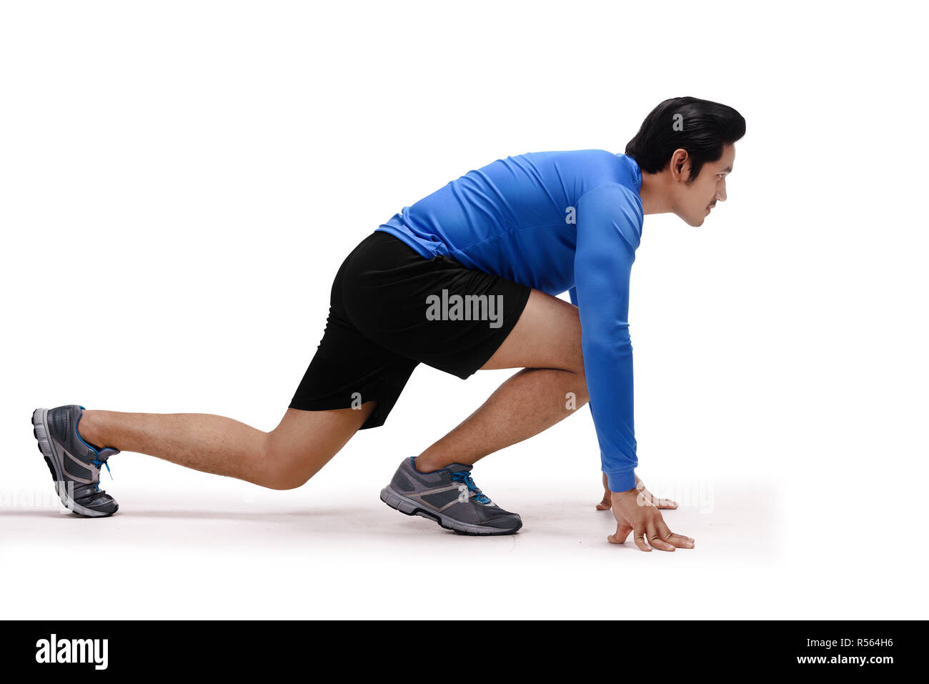 Portrait of asian male runner at ready position Stock Photo - Alamy