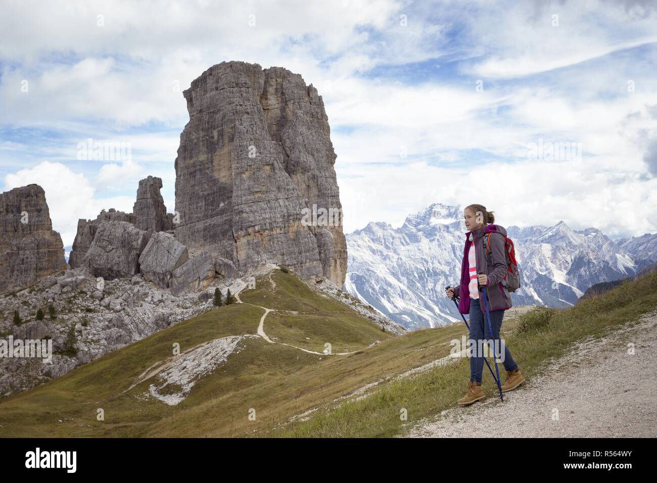 girl hiker at the mountains Dolomites, Italy. Cinque Torri Stock Photo ...