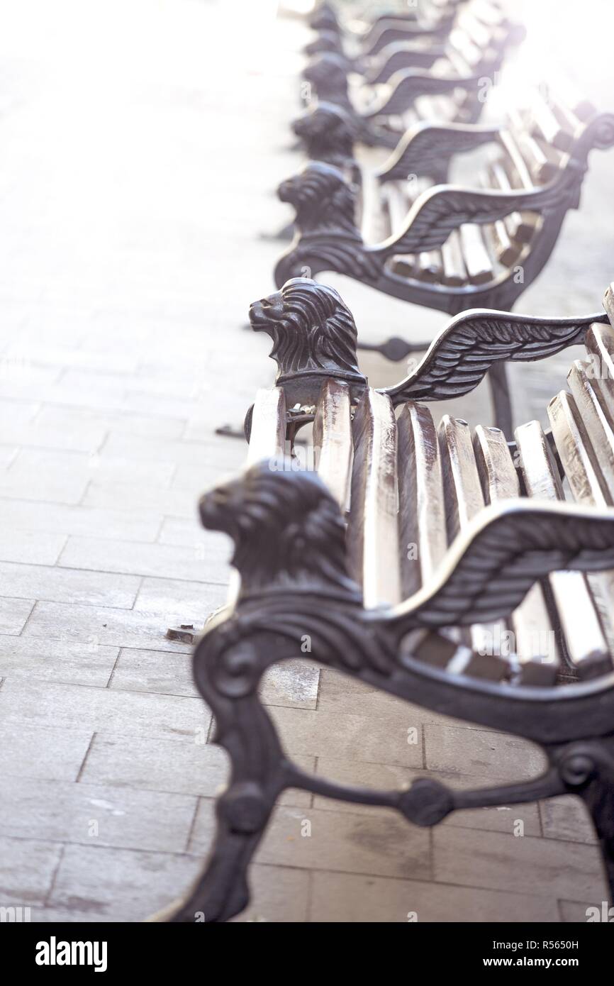Beautiful old benches on the street of a European city Stock Photo - Alamy