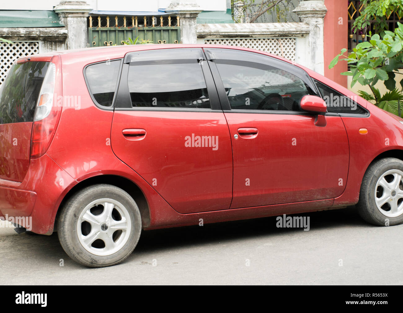 FOUR DOOR SMALL RED CAR Stock Photo - Alamy