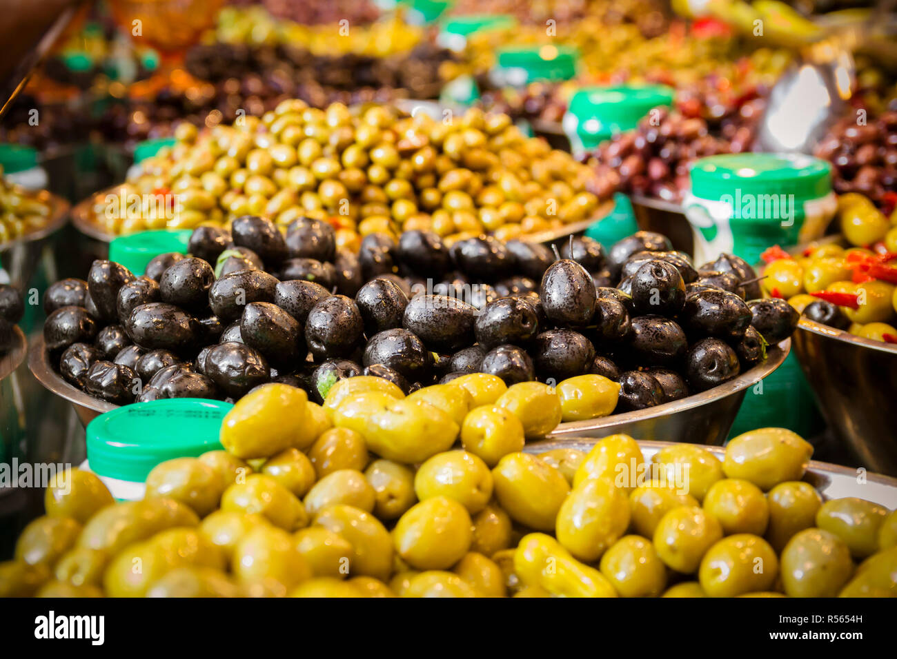 Olives at a market stall. A variety of types of olives Stock Photo - Alamy