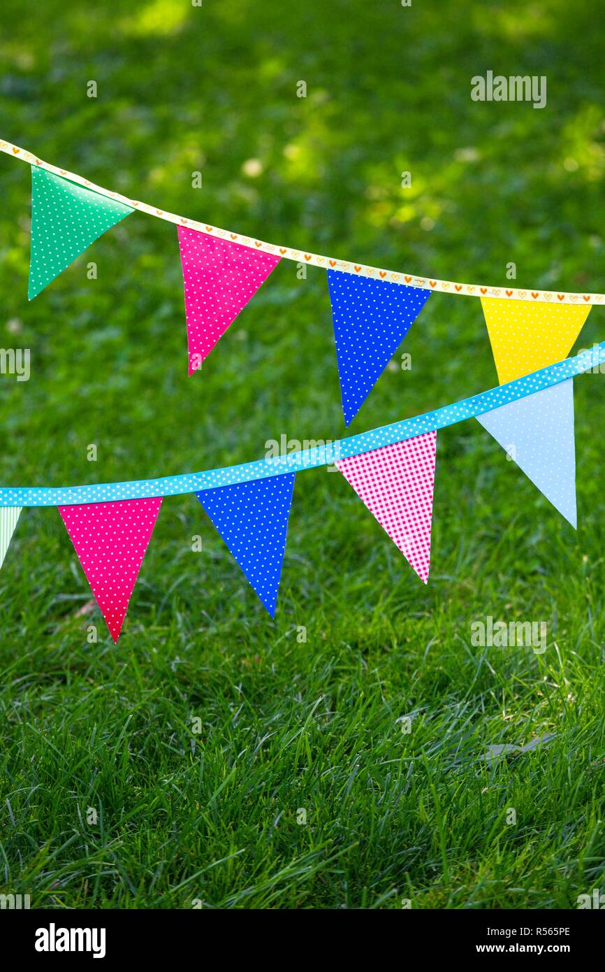 String of colorful flags is hanging on a rope hi-res stock photography ...