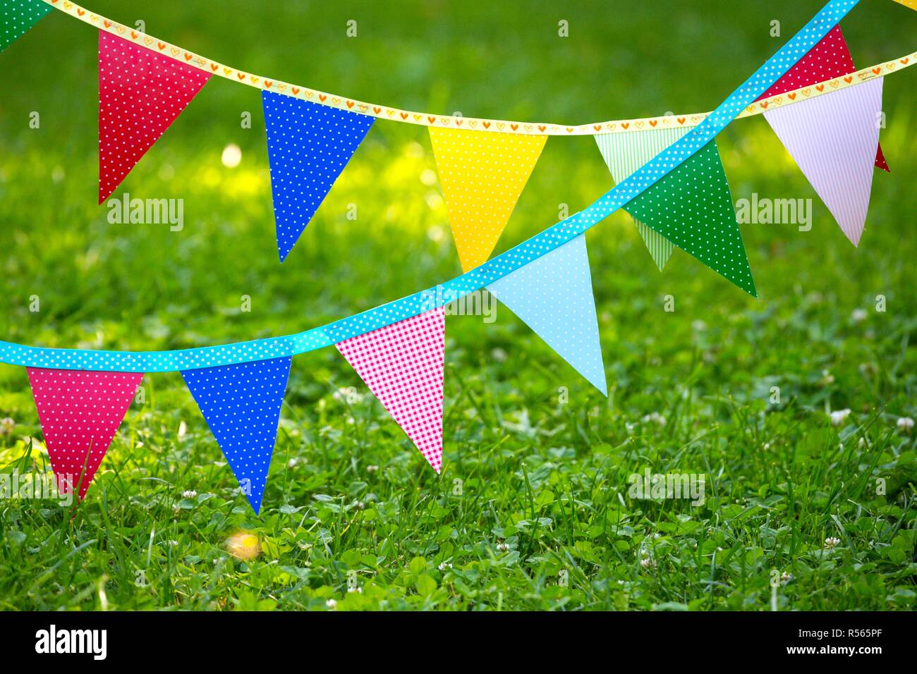 String of colorful flags is hanging on a rope hi-res stock photography ...