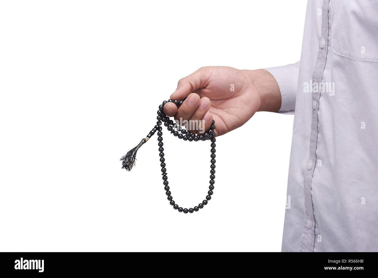 Hand of muslim man praying while holding tasbih Stock Photo - Alamy