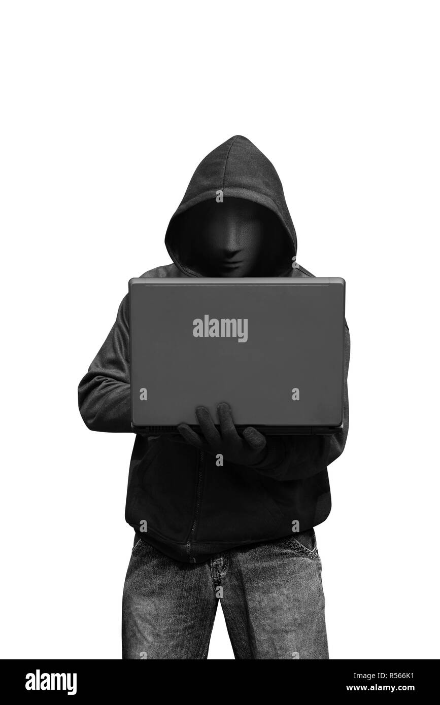 Hacker with mask holding laptop while typing Stock Photo - Alamy