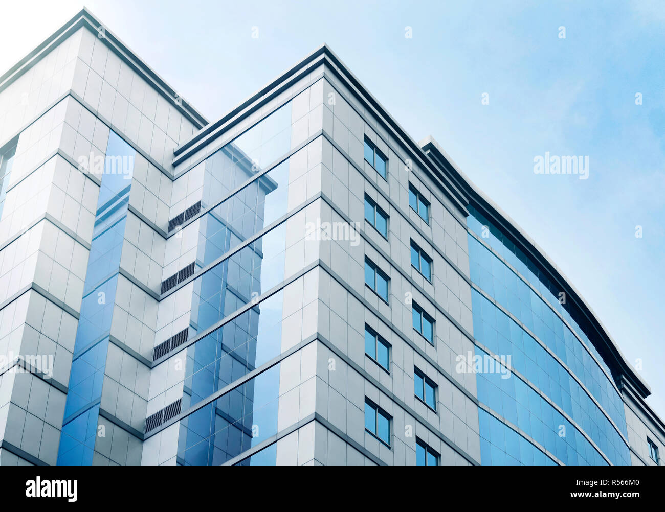 Windows of business office building with blue sky Stock Photo - Alamy