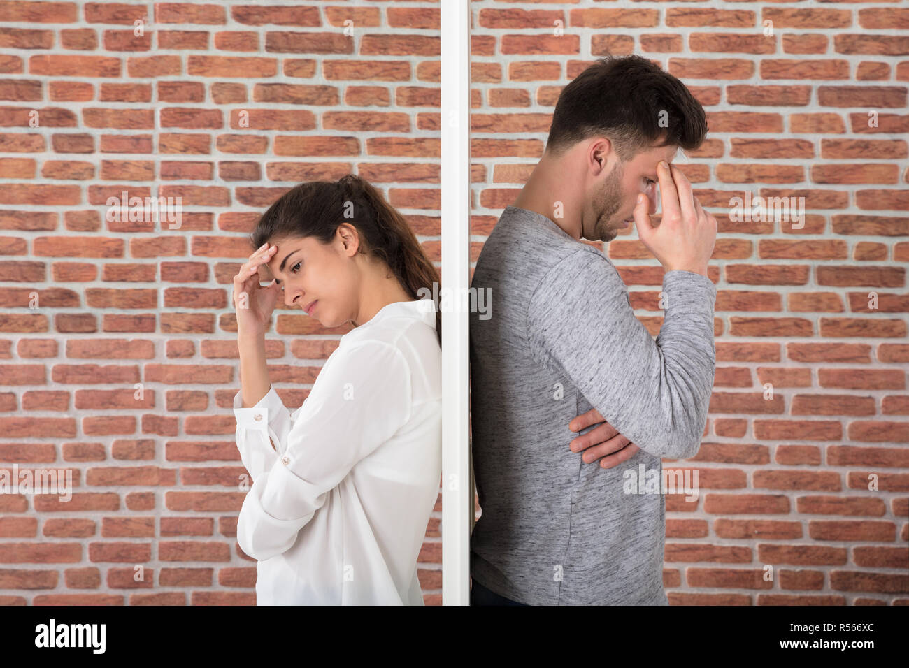 Depressed Young Couple Stock Photo - Alamy