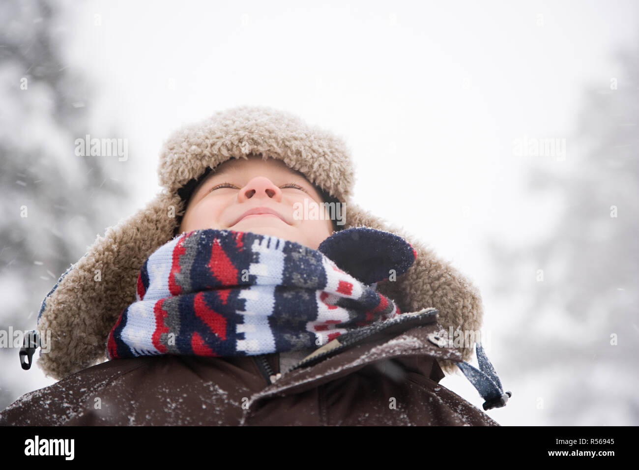 Boy in the snow Stock Photo - Alamy