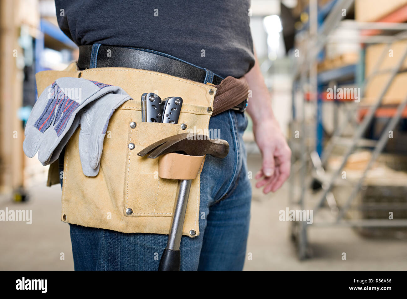 Workman with toolbelt Stock Photo - Alamy