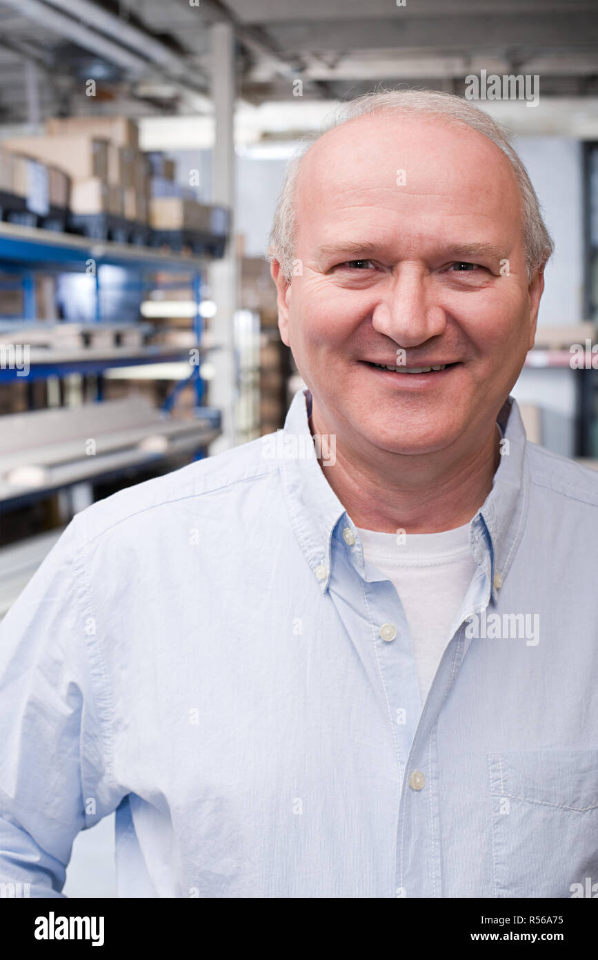 Man in warehouse Stock Photo - Alamy