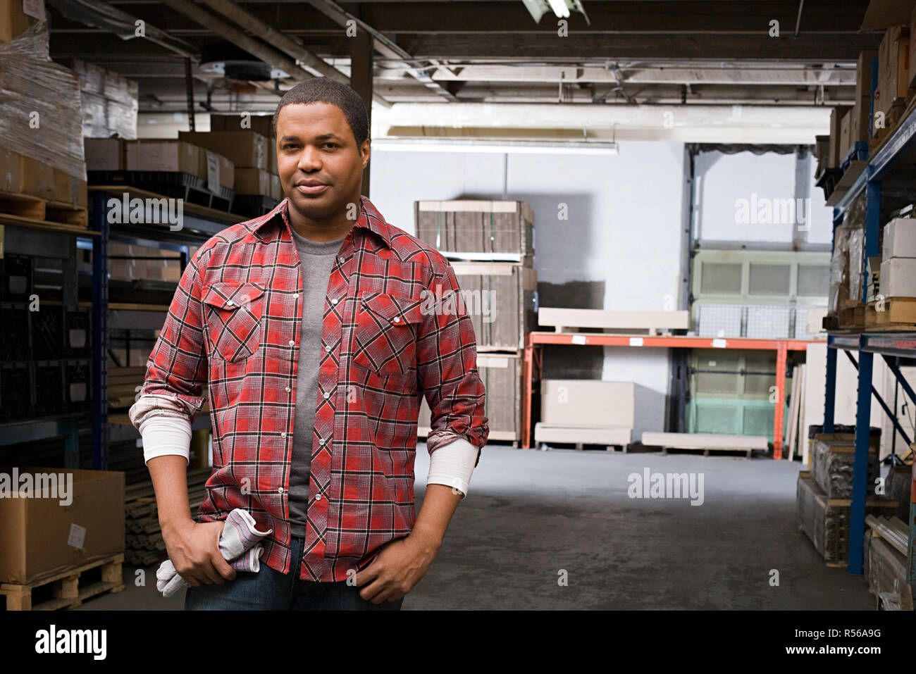 Man in warehouse Stock Photo - Alamy