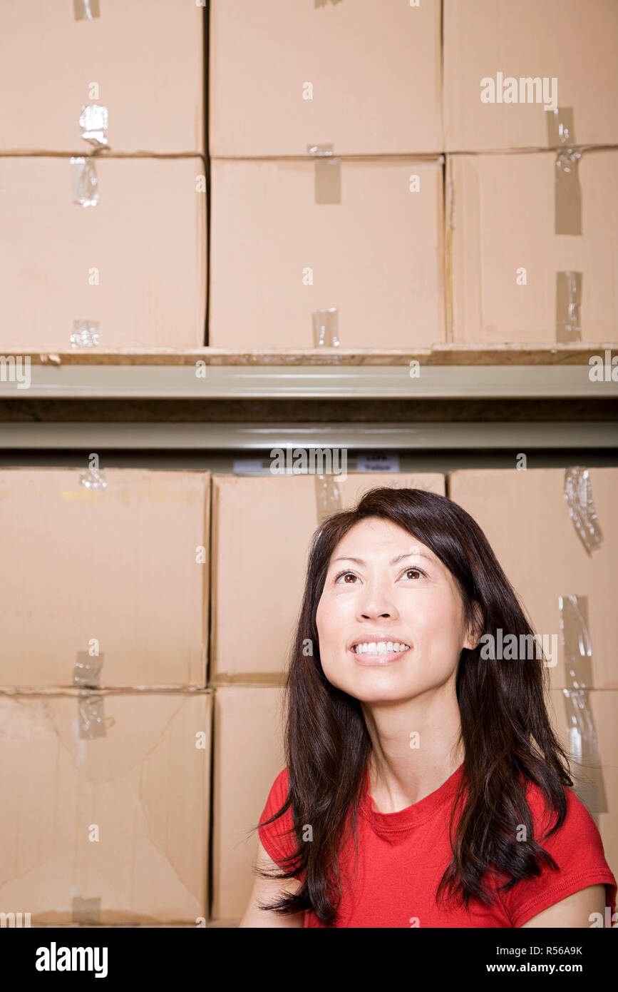 Woman and cardboard boxes Stock Photo - Alamy
