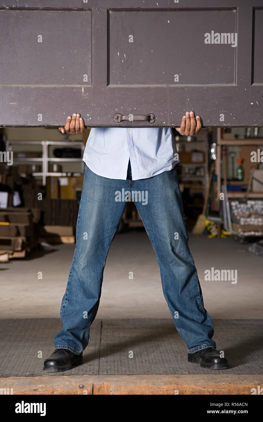 Opening warehouse door Stock Photo - Alamy