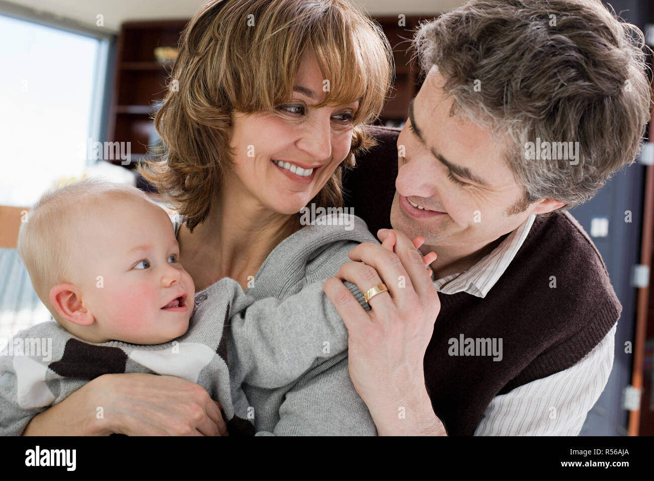 Parents and their baby Stock Photo - Alamy