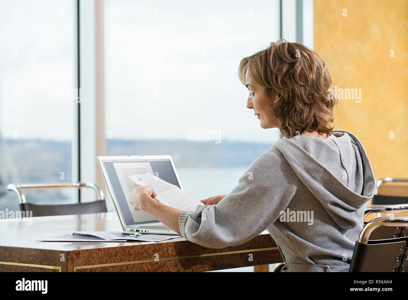 Perspective view with a woman reading a letter hi-res stock photography ...