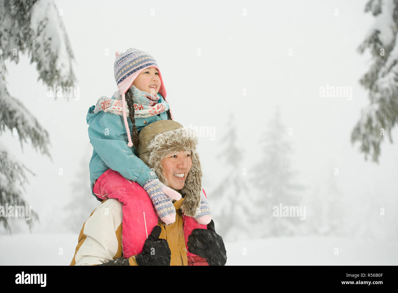 Father and daughter in snow Stock Photo - Alamy