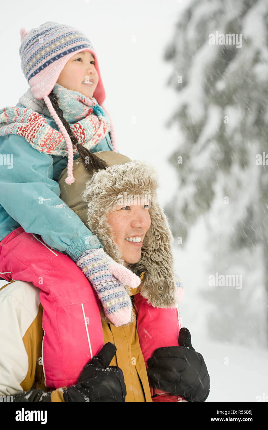 Father and daughter in snow Stock Photo - Alamy