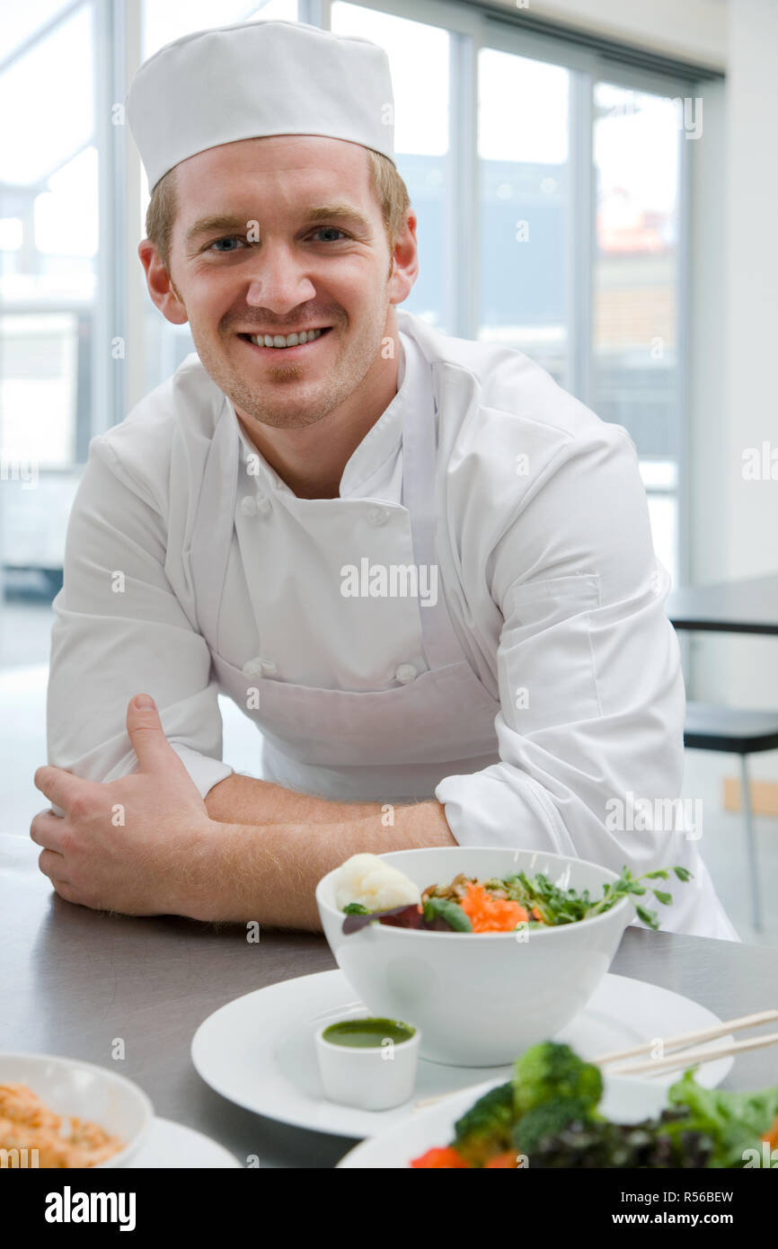Chef with meal Stock Photo - Alamy