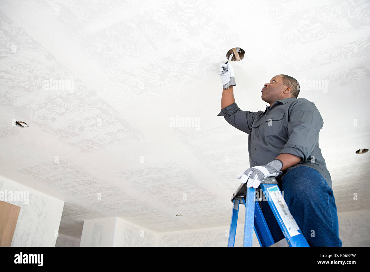 An electrician fixing wires Stock Photo - Alamy