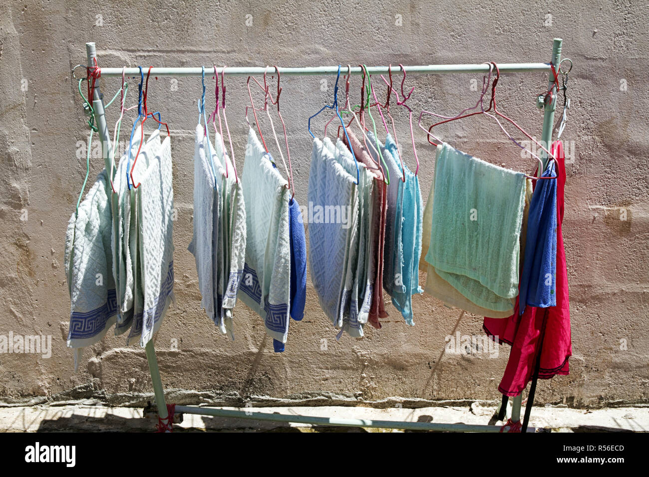 cement wall domestic street drying clothes Stock Photo - Alamy