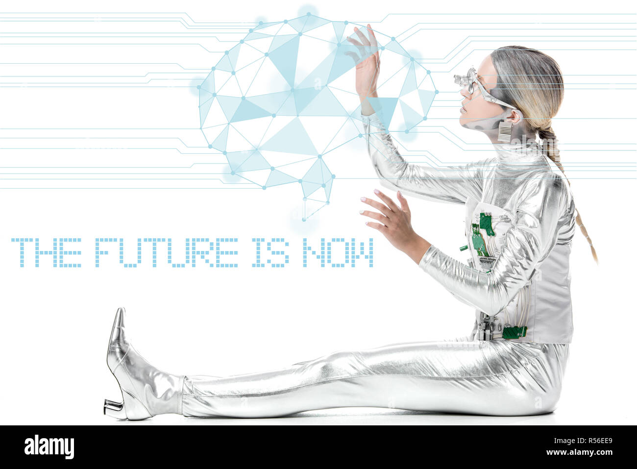 side view of silver cyborg sitting and touching digital data isolated ...