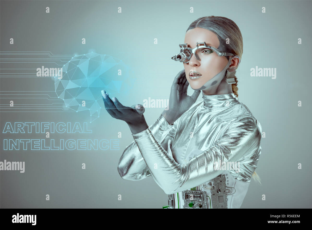futuristic silver cyborg touching digital data with "artificial ...
